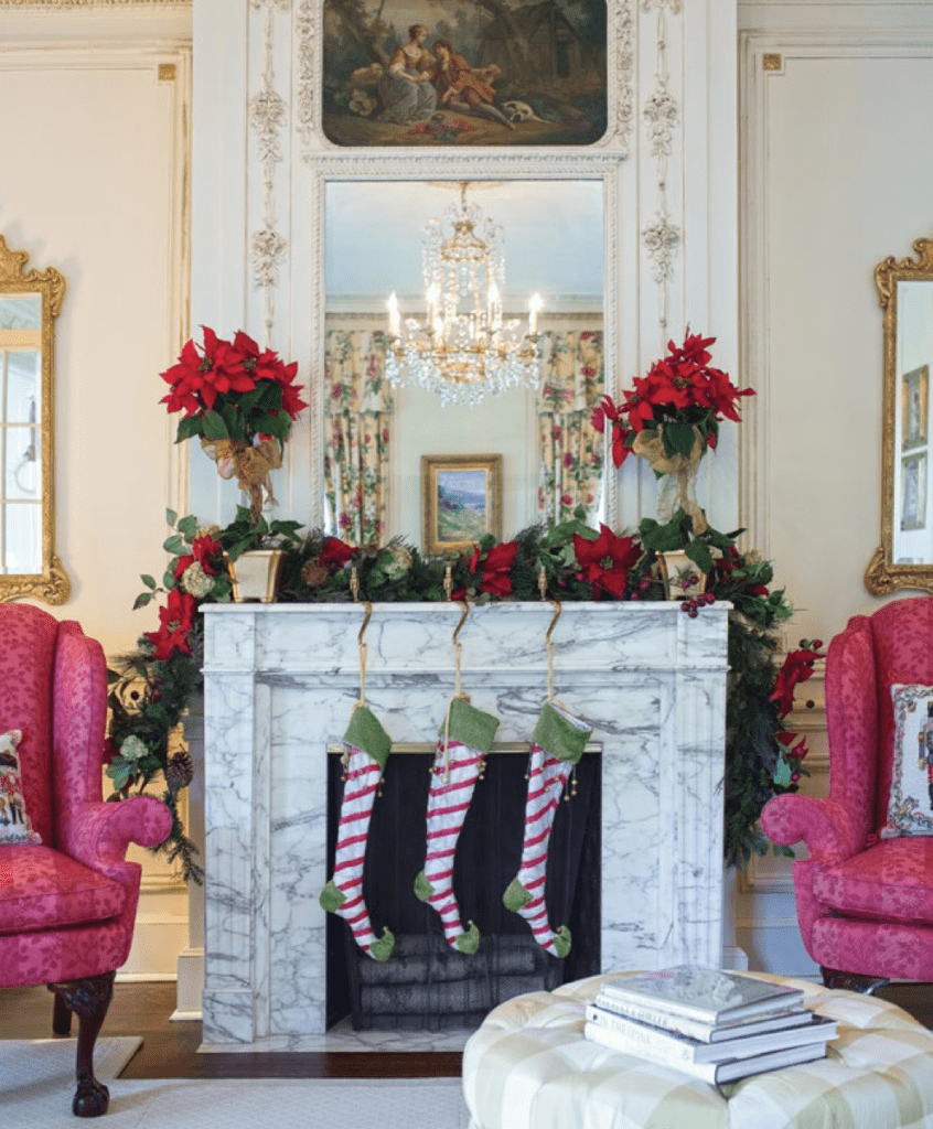 christmas-stockings-mantle-fireplace-red-poinsettias-elf - The Glam Pad